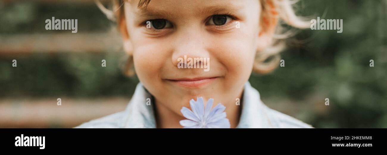 portrait of the face of a cute happy smiling little five year old ...