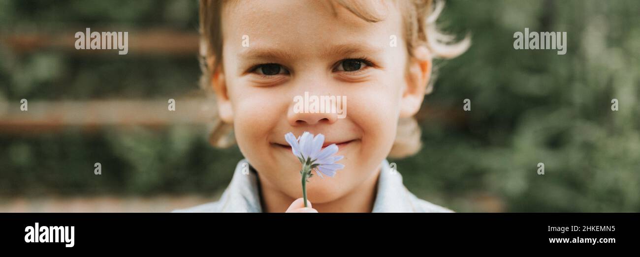 portrait of the face of a cute happy smiling little five year old ...