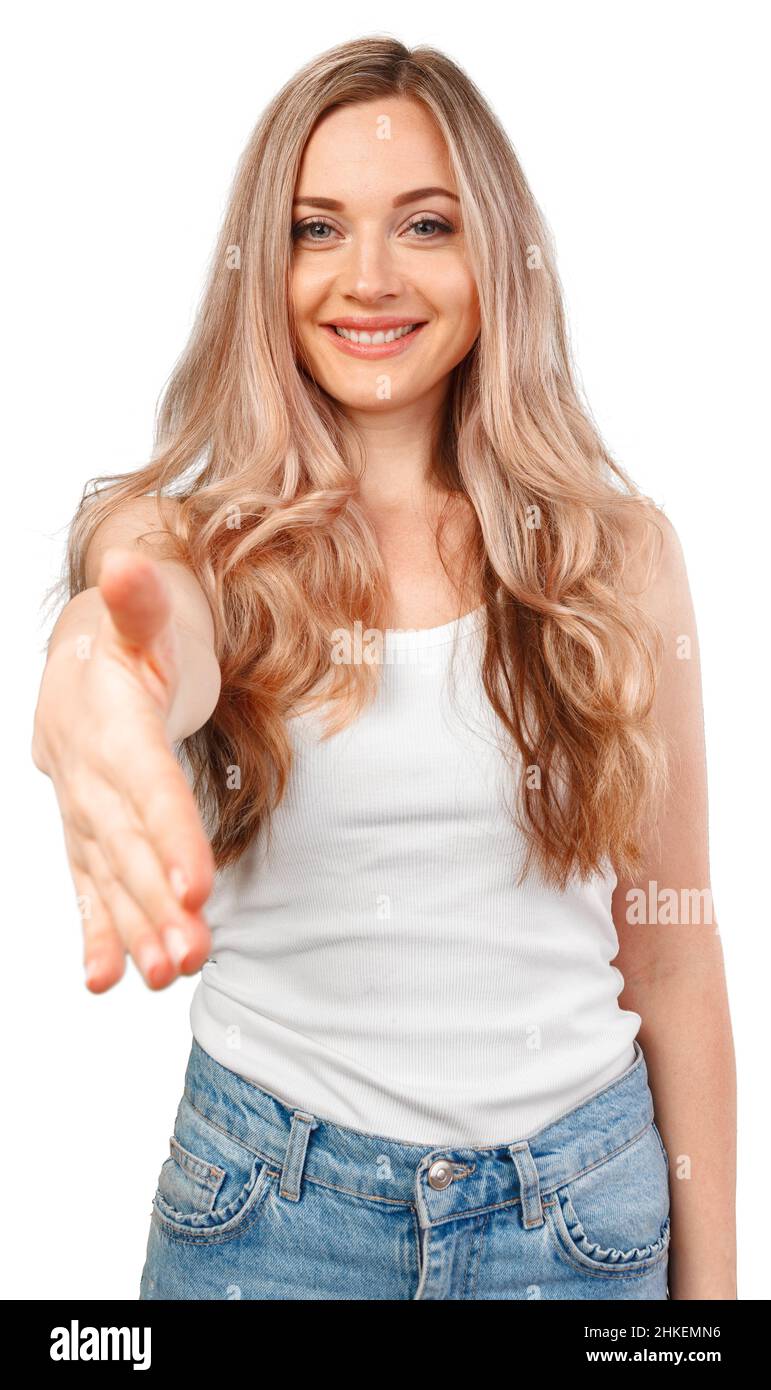 Portrait of pretty young woman holding out her hand to greet someone ...