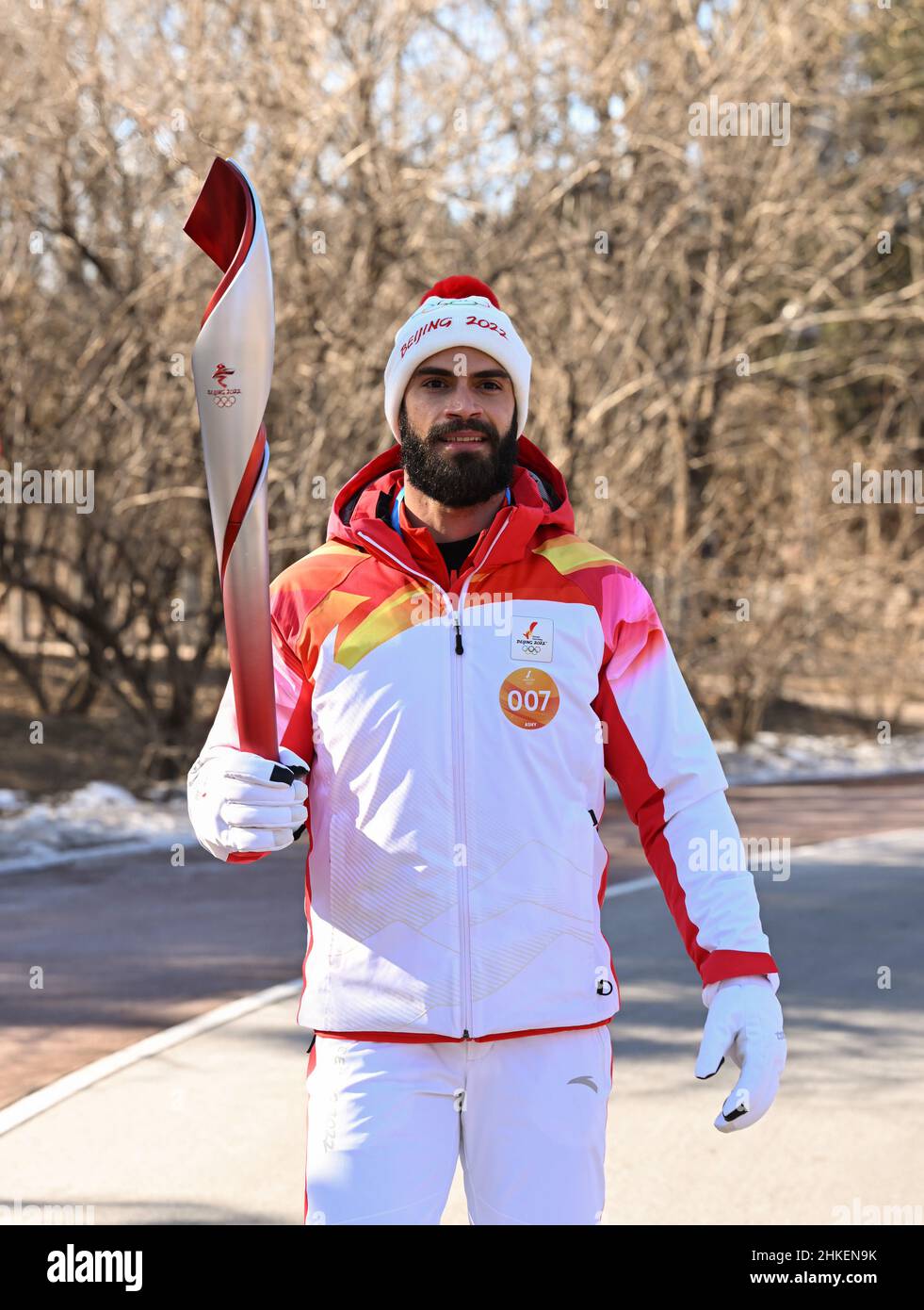 Beijing, China. 4th Feb, 2022. Torch bearer Luca Balerna presents the ...