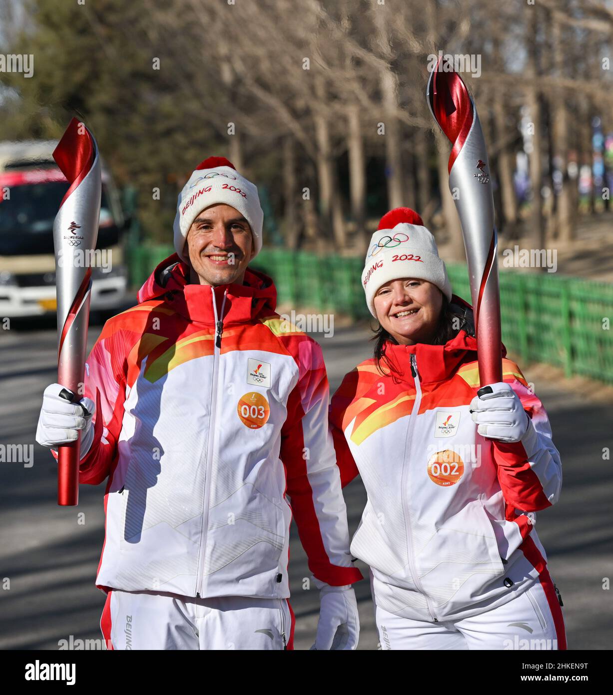 Beijing, China. 4th Feb, 2022. Torch bearers Vincent Robert (L) and ...