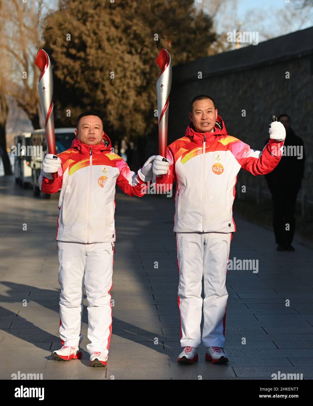 Beijing, China. 4th Feb, 2022. Torch bearers Wang Hua (L) and Liu ...
