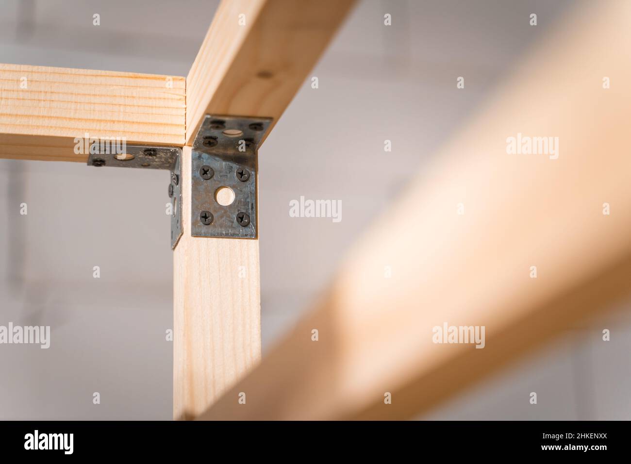 Corner connection of wooden bars with iron corners and black self ...