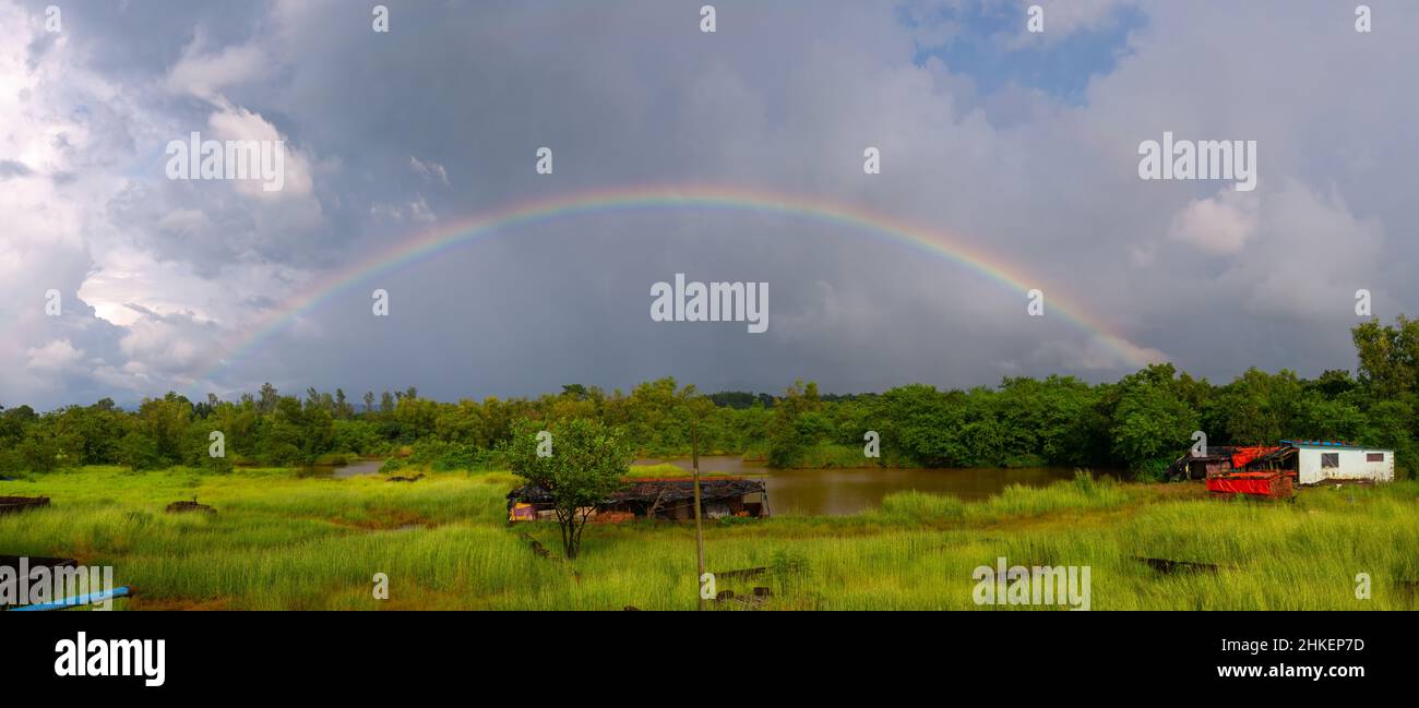 Full rainbow panorama over the field after passing rainstorm Stock ...