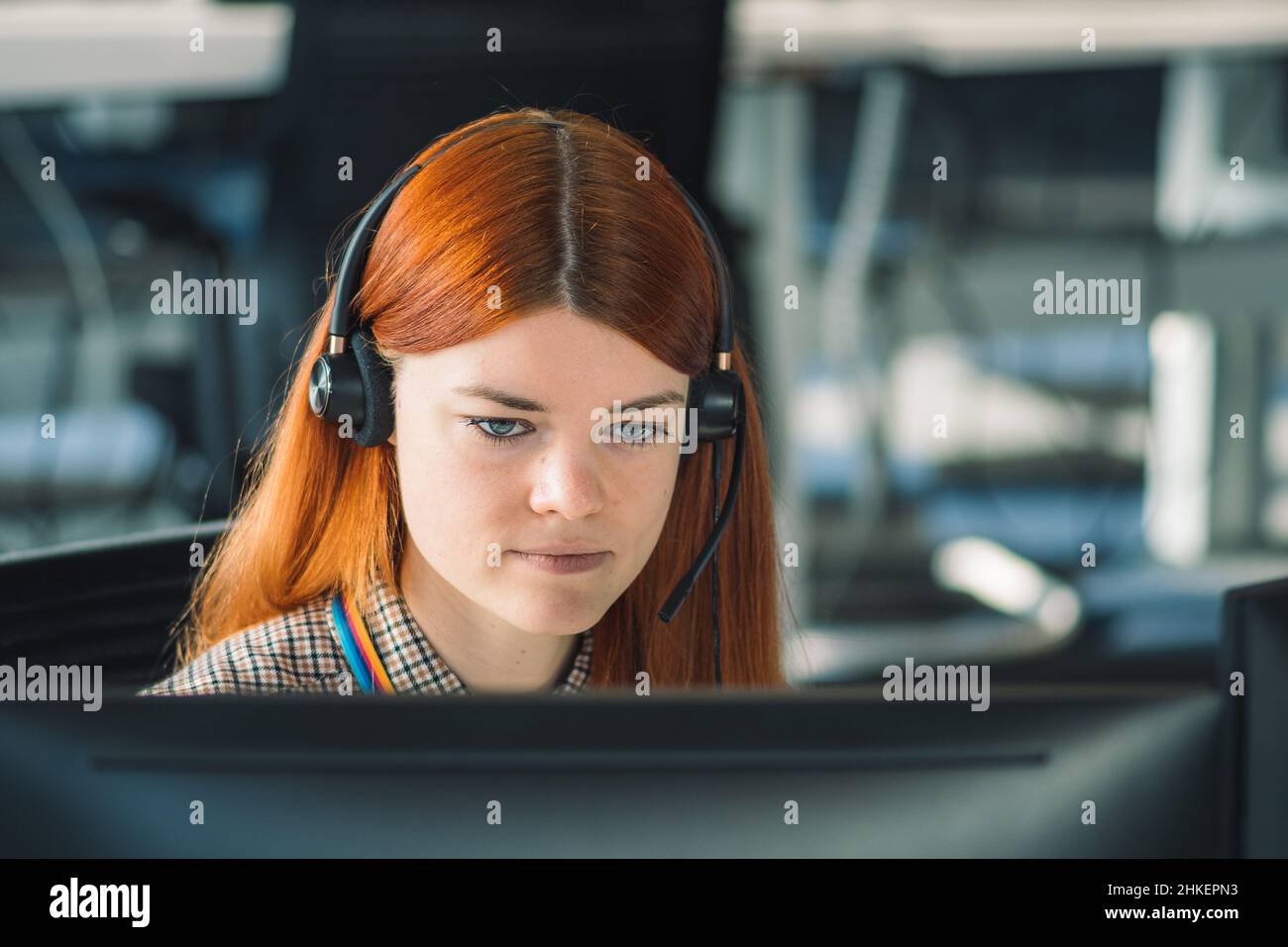 Beautiful young Caucasian red hair girl dressing casual working in the ...