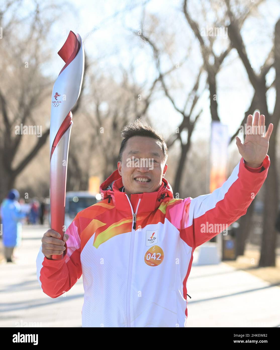 Beijing, China. 4th Feb, 2022. Torch bearer Dang Jian runs with the torch during the Beijing ...