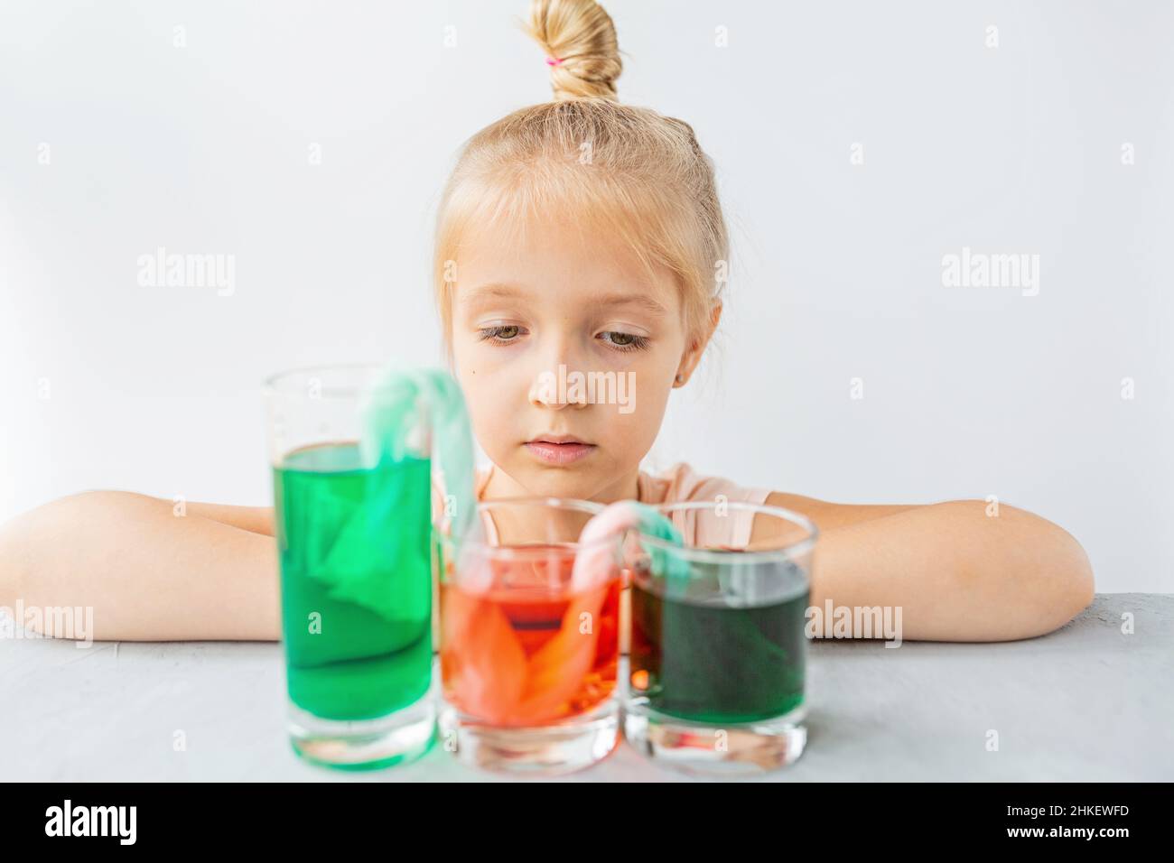 cute little girl six years old doing laboratory experiment with ...