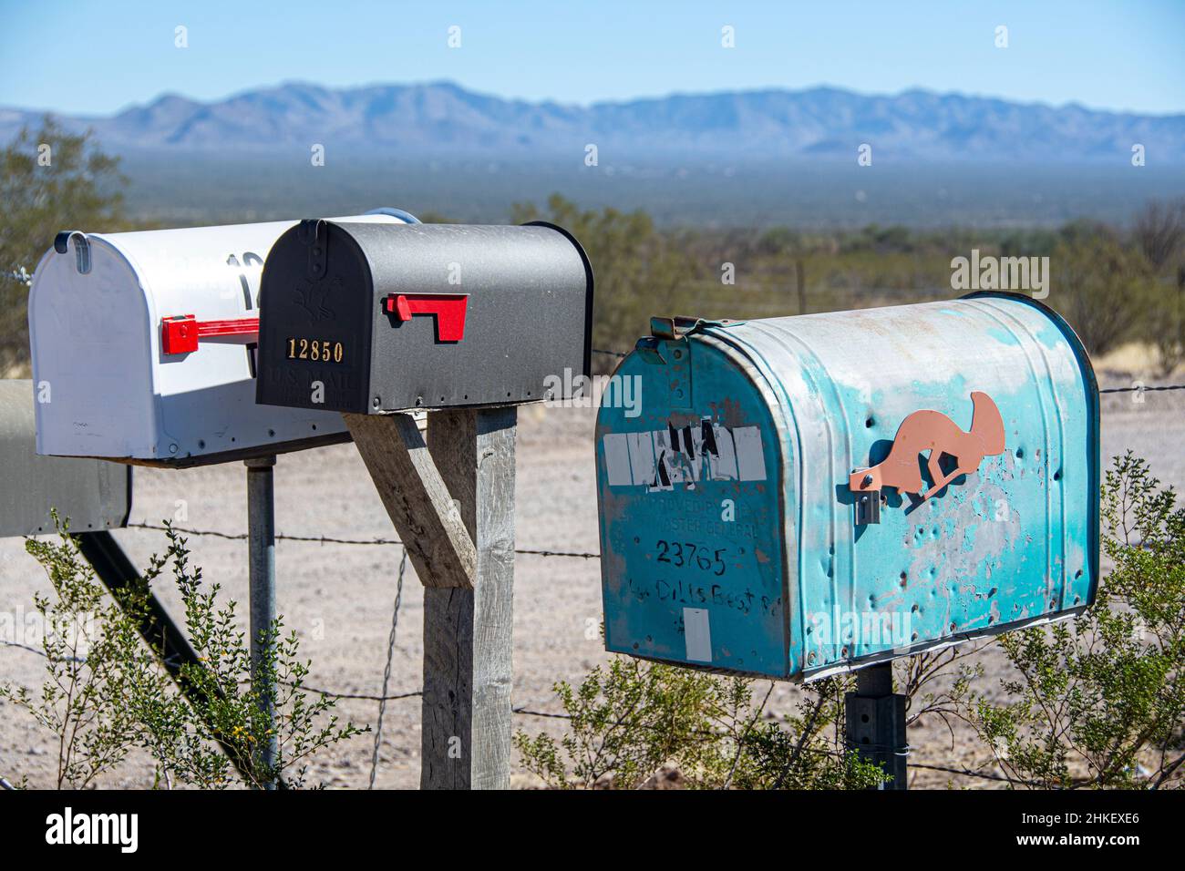 Three rural mail boxes colored in a black in white image, off of the 10 ...
