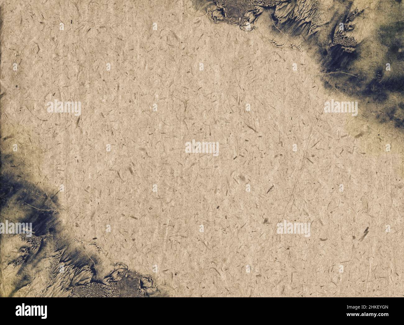 A scan of a sheet of old vintage paper stained with blotches of colored ...