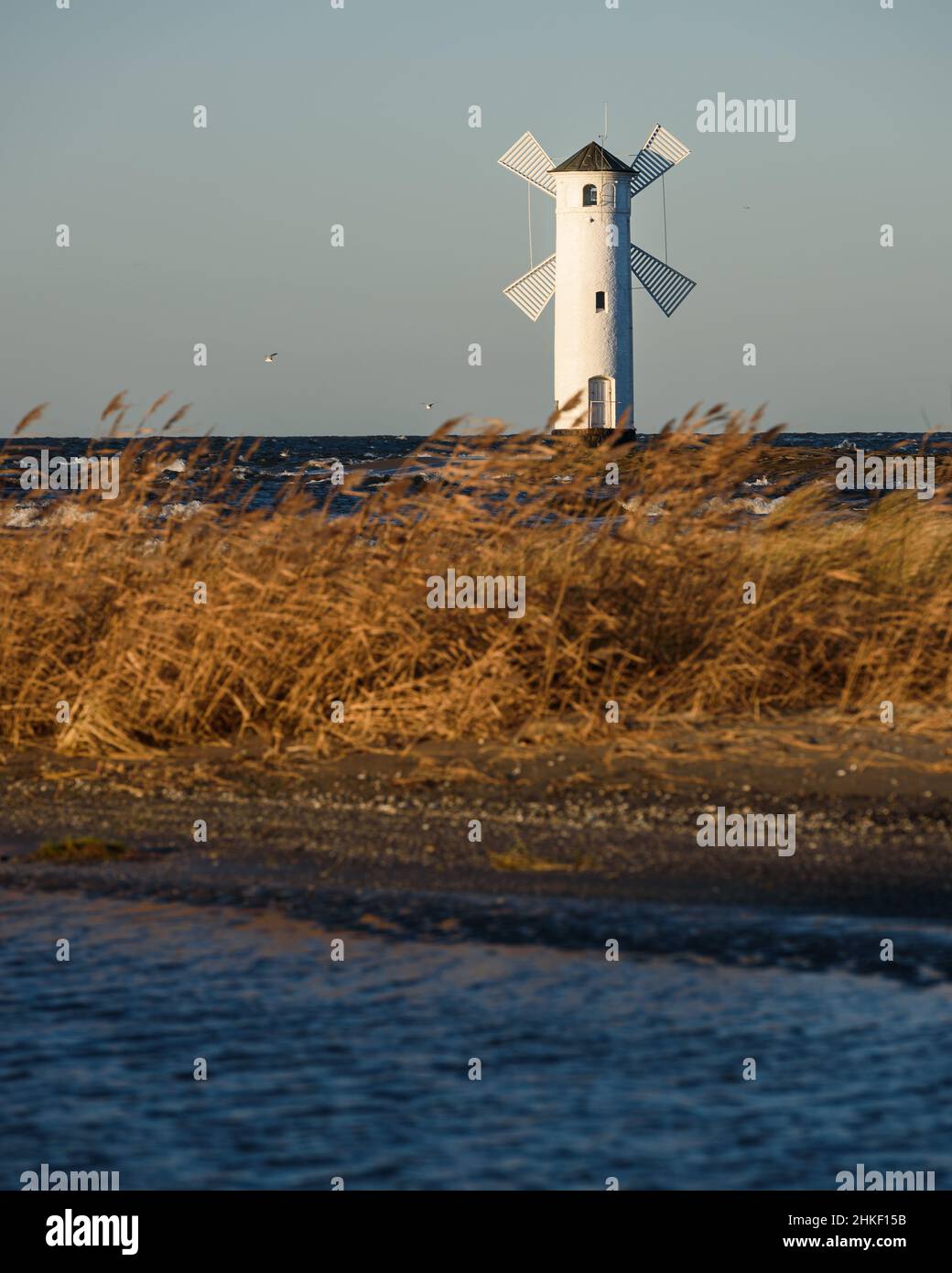 Landscape with lighthouse looks like windmill. Swinoujcie in Poland ...