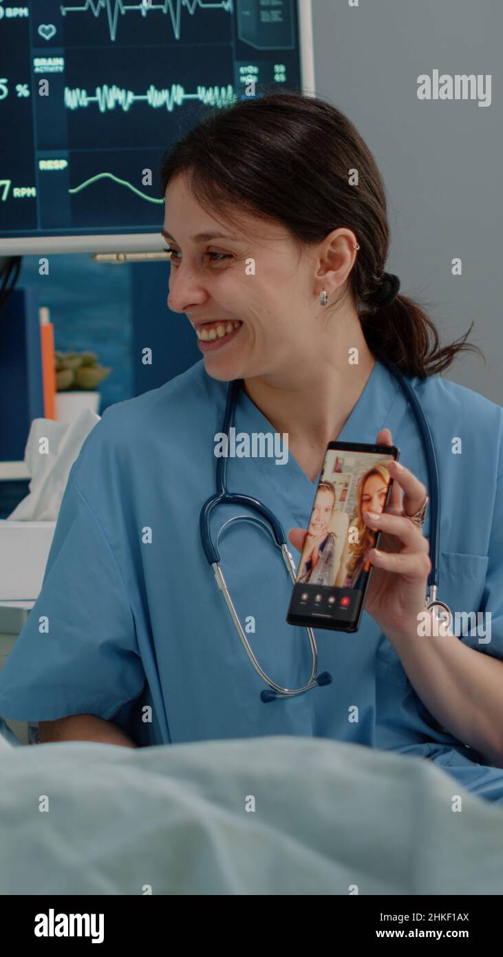 Senior woman talking to family on video call communication in nursing ...