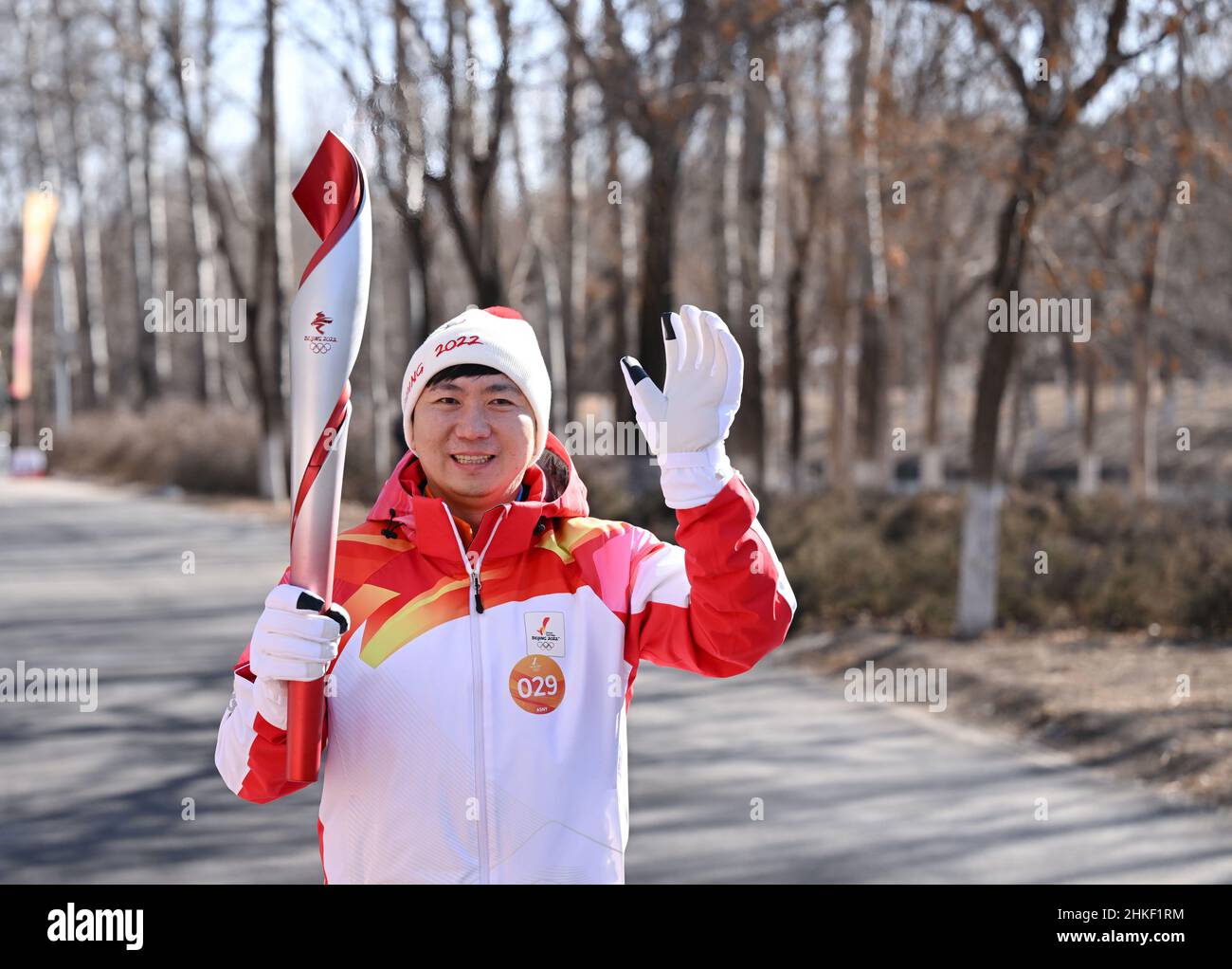 Beijing, China. 4th Feb, 2022. Torch bearer Ryu Seung Min runs with the ...