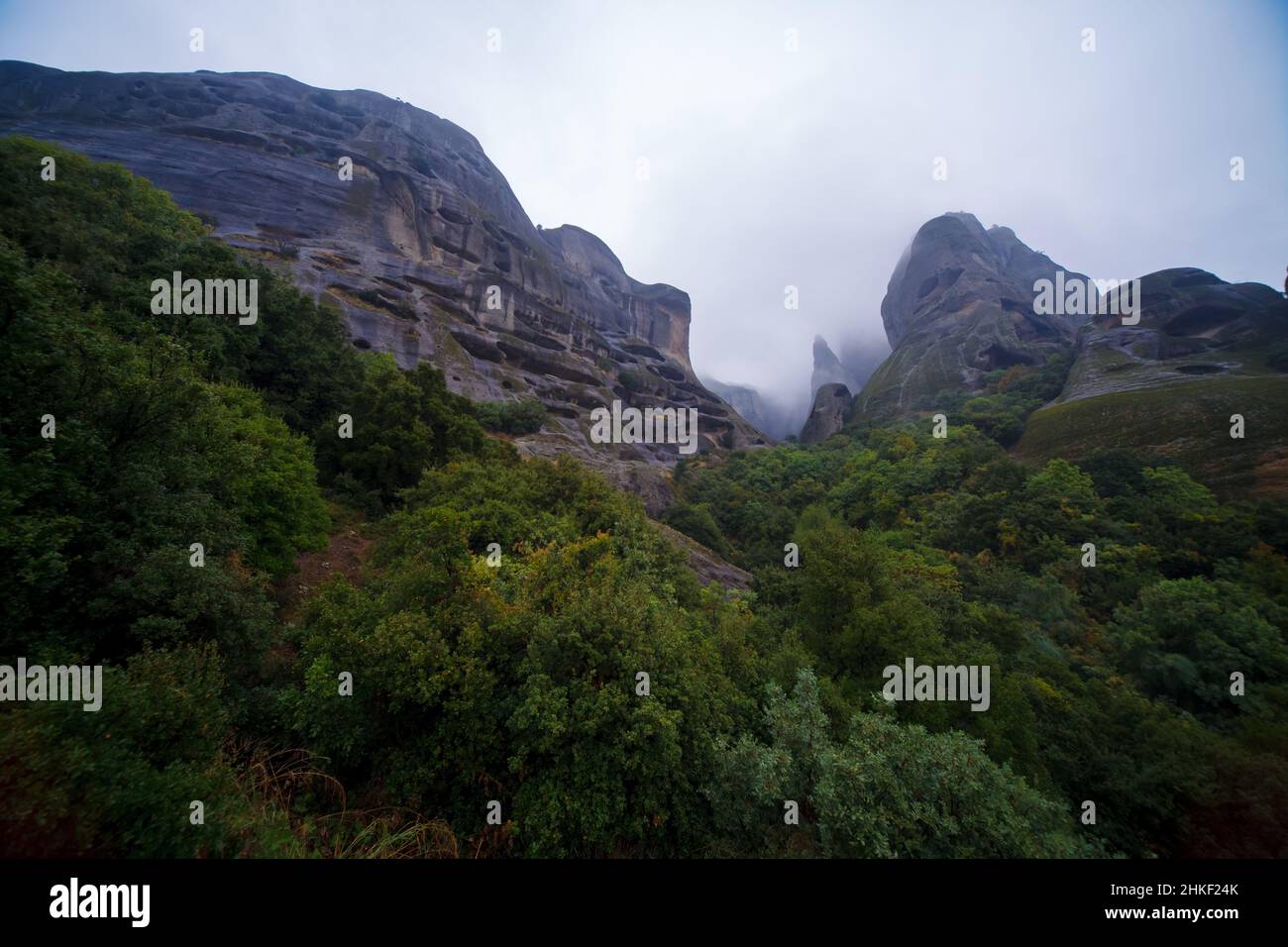 Meteora rocks in Greece in the fog Stock Photo - Alamy