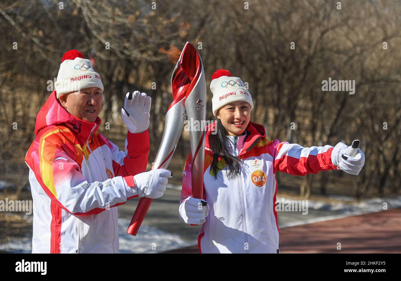 Beijing, China. 4th Feb, 2022. Torch bearers Ban Ki-moon (L) and Zhang ...