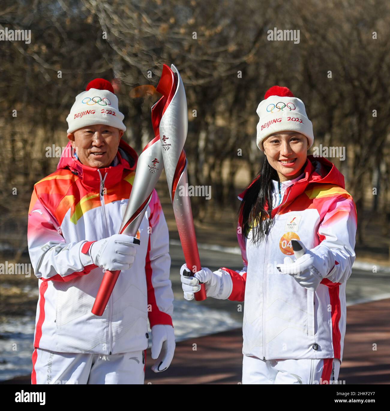 Beijing, China. 4th Feb, 2022. Torch bearers Ban Ki-moon (L) and Zhang ...