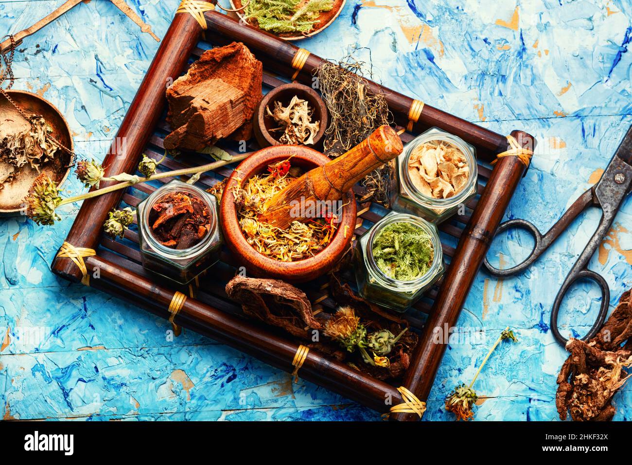 Healing herbs and plants. Set of homeopathic herbs in a wooden tray ...