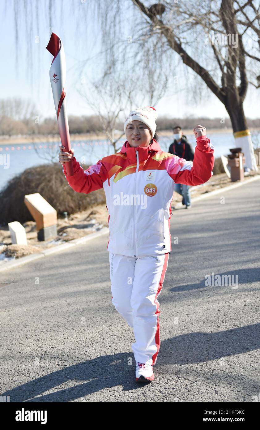 Beijing, China. 4th Feb, 2022. Torch bearer Yu Yan runs with the torch during the Beijing 2022 ...