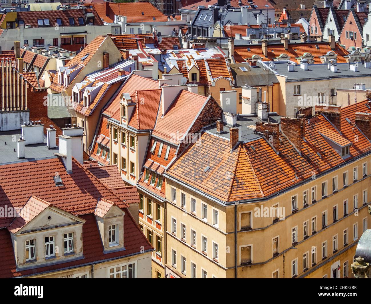 view from above on orange tiled rooftops of old medieval buildings of ...
