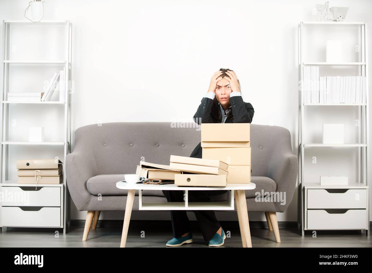 Upset business woman, unhappy secretary girl with folders with the ...