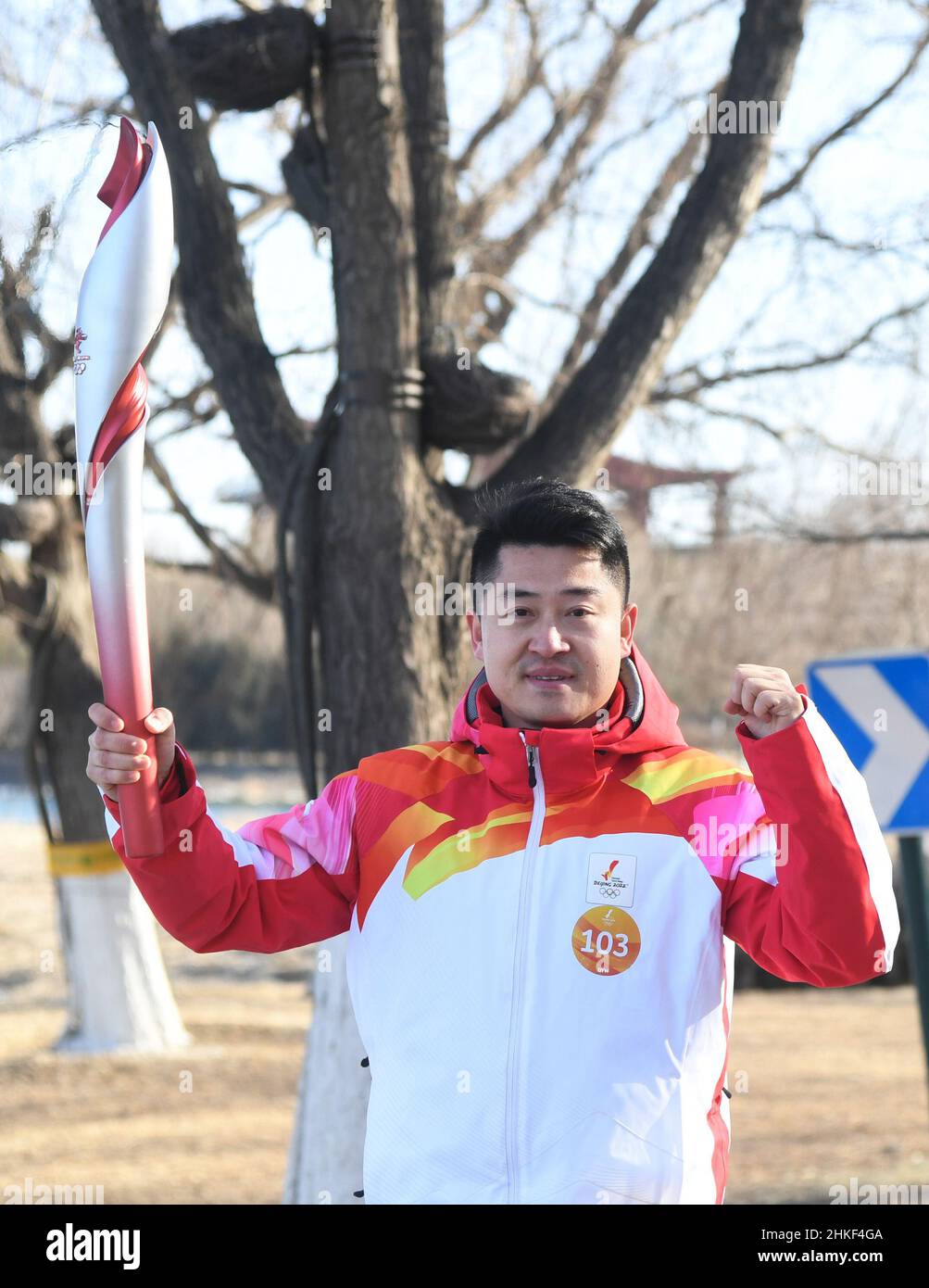 Beijing, China. 4th Feb, 2022. Torch bearer Li Da runs with the torch during the Beijing 2022 ...
