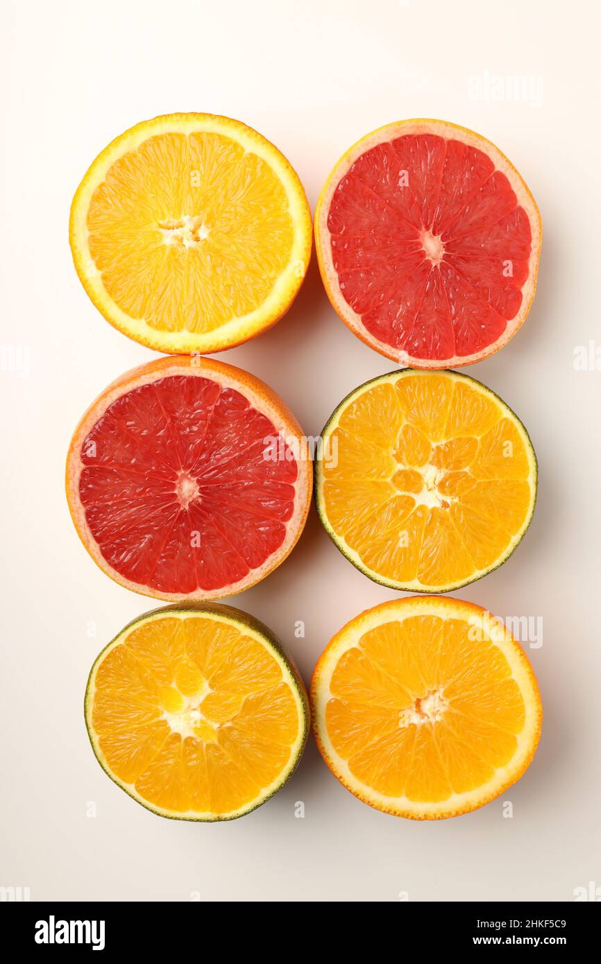 Citrus fruits halves on white background, top view Stock Photo - Alamy
