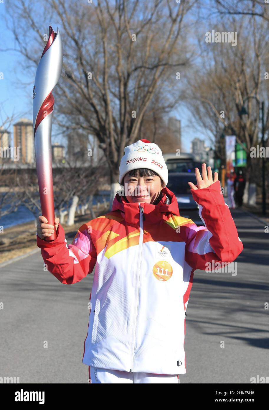Beijing, China. 4th Feb, 2022. Torch bearer Liu Chaoying runs with the ...