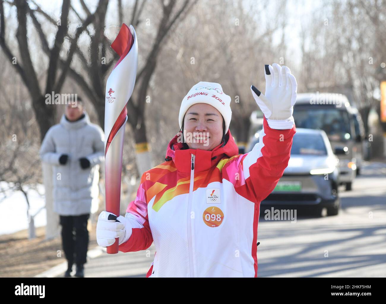 Beijing, China. 4th Feb, 2022. Torch bearer Gao Ying runs with the ...