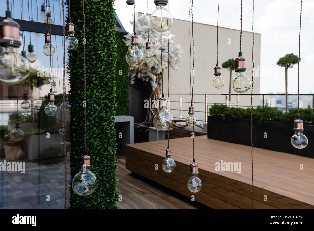Light bulb decor in outdoor party Stock Photo - Alamy