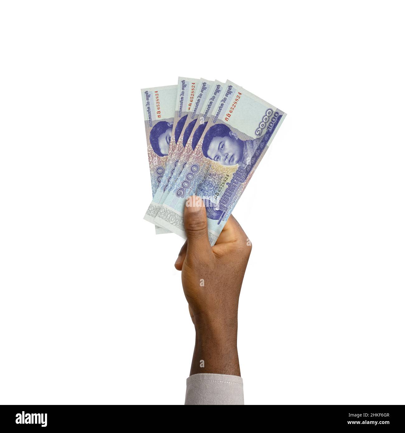 Black Hand holding 3D rendered 1000 Cambodian riel notes isolated on ...
