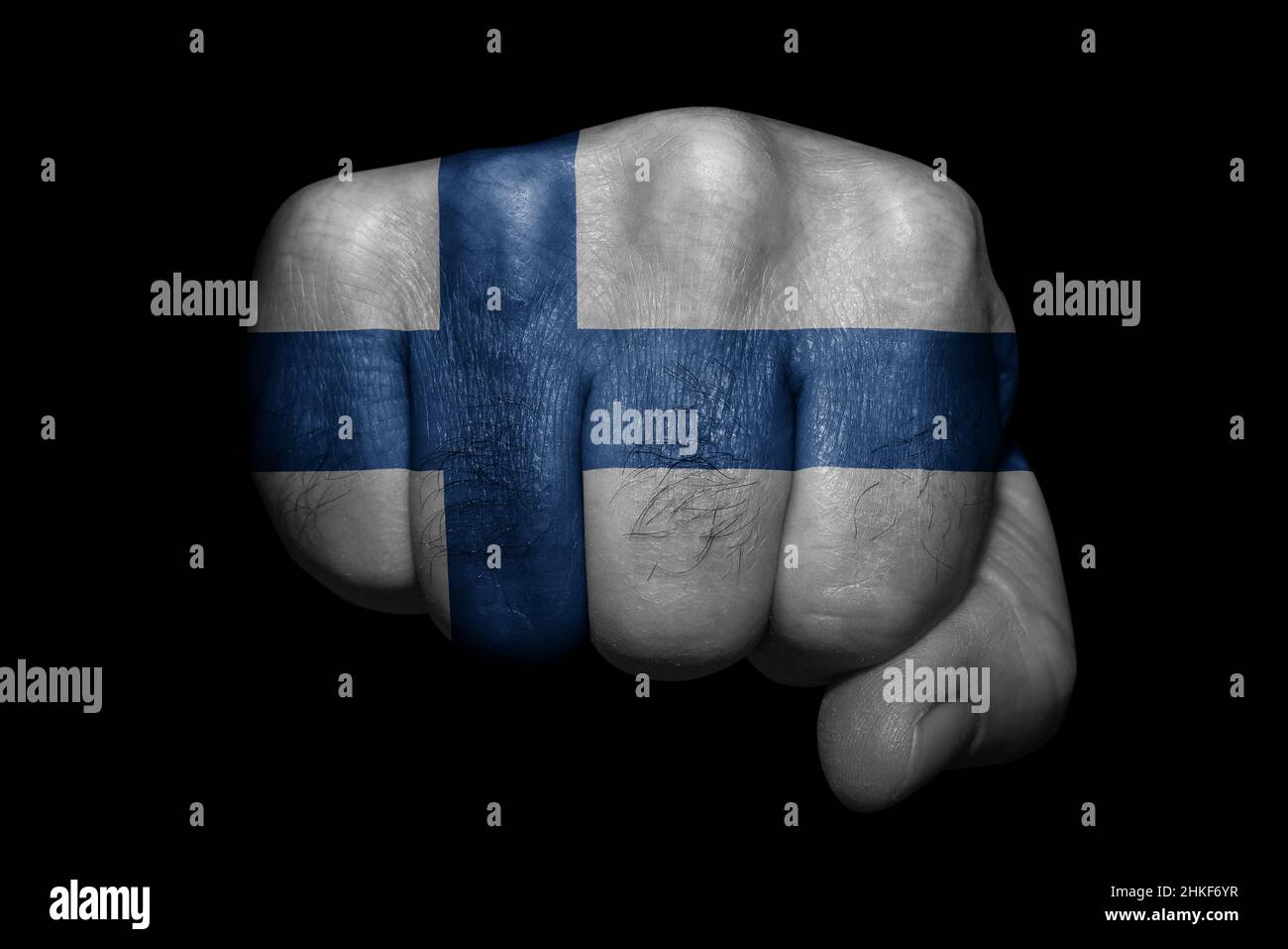 Flag of Finland painted on strong fist on black background Stock Photo ...