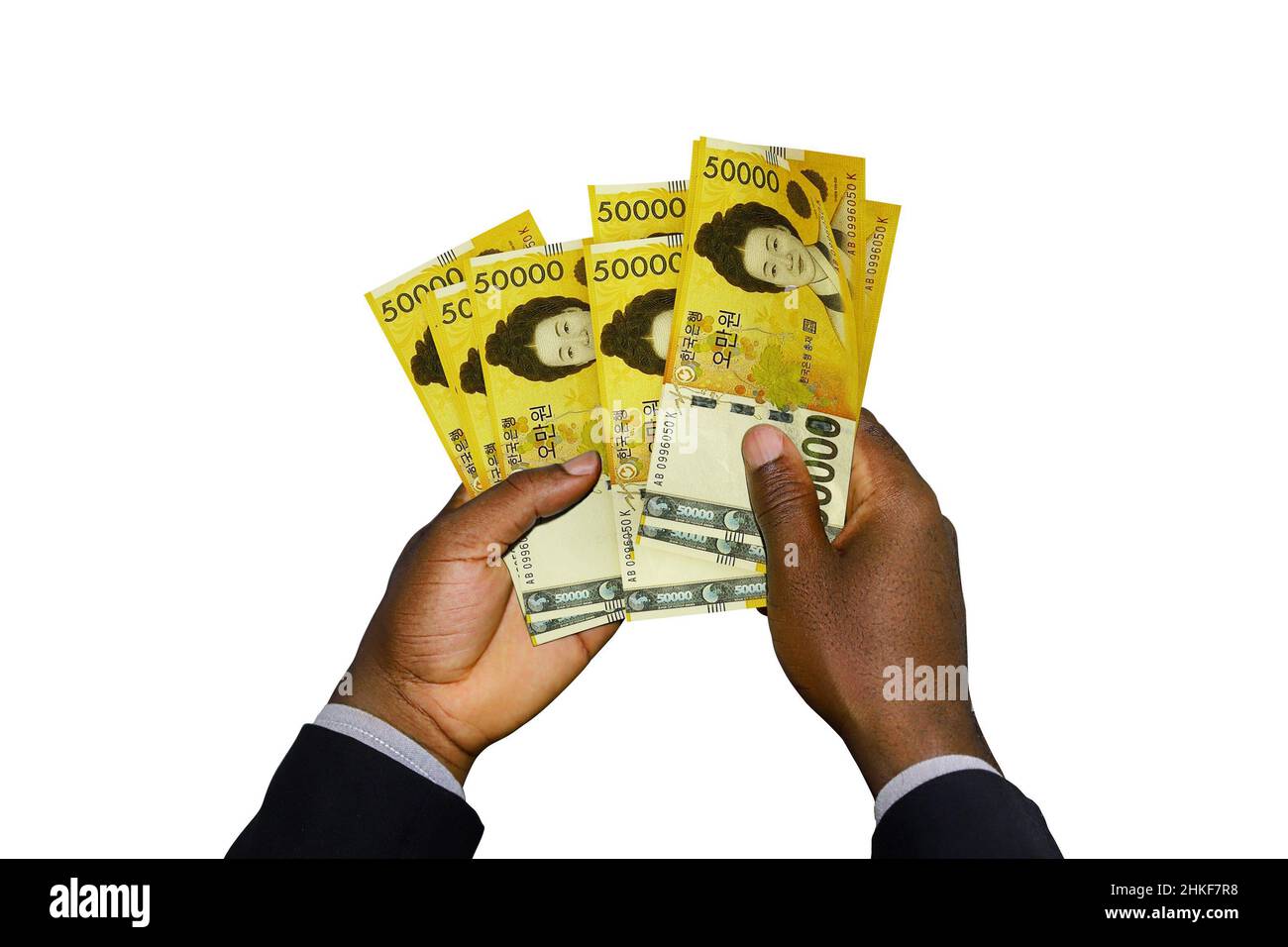 Black Hands in suit holding 3D rendered South Korean won notes Stock ...