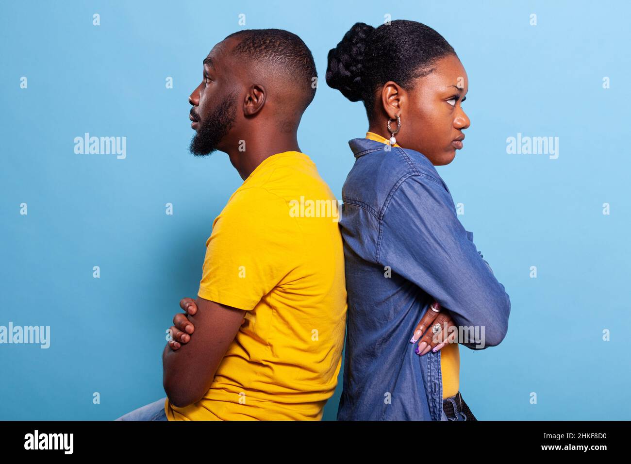 Two angry people back to back hi-res stock photography and images - Alamy
