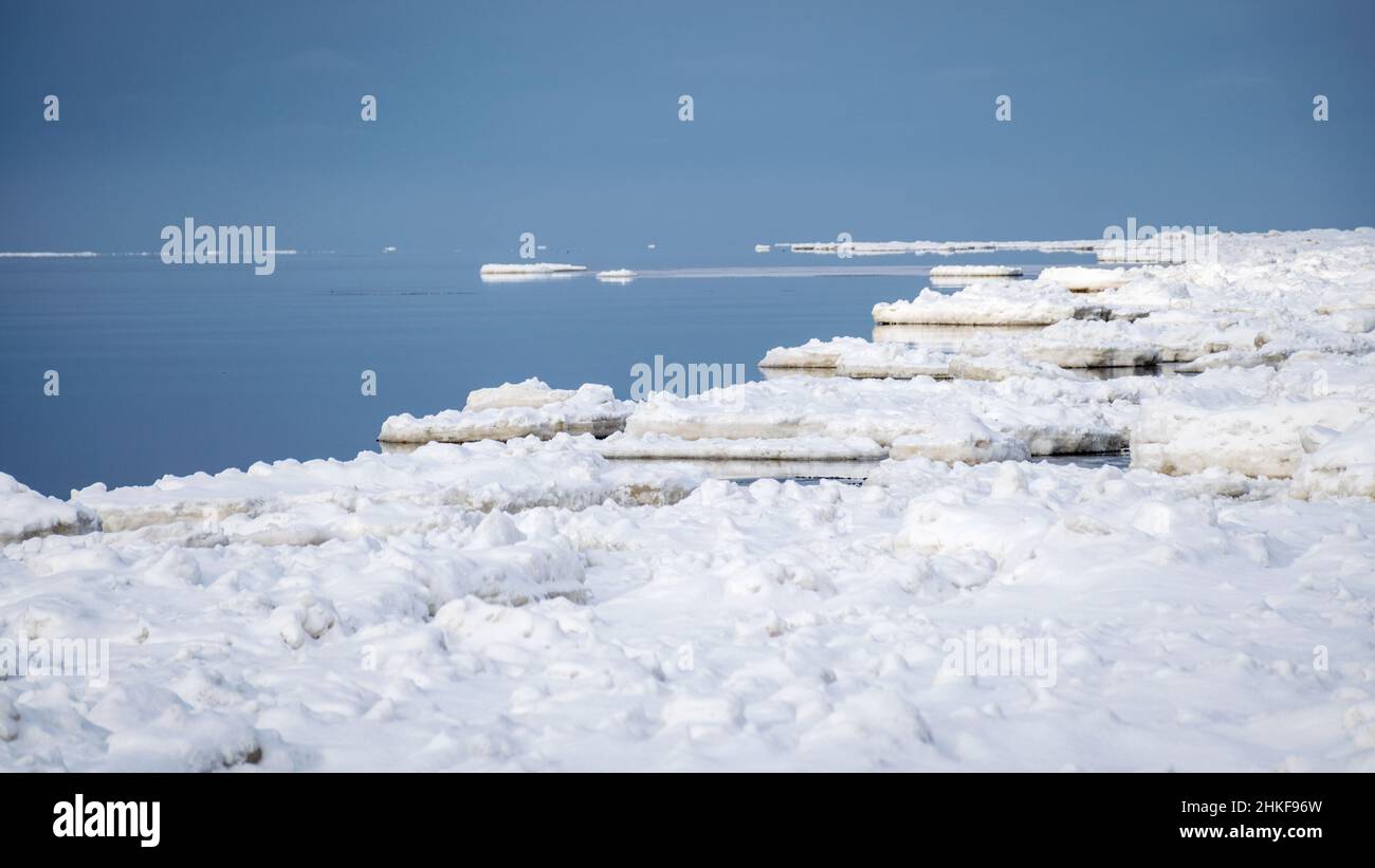 white pieces of ice floating in the sea, winter landscape from the sea ...