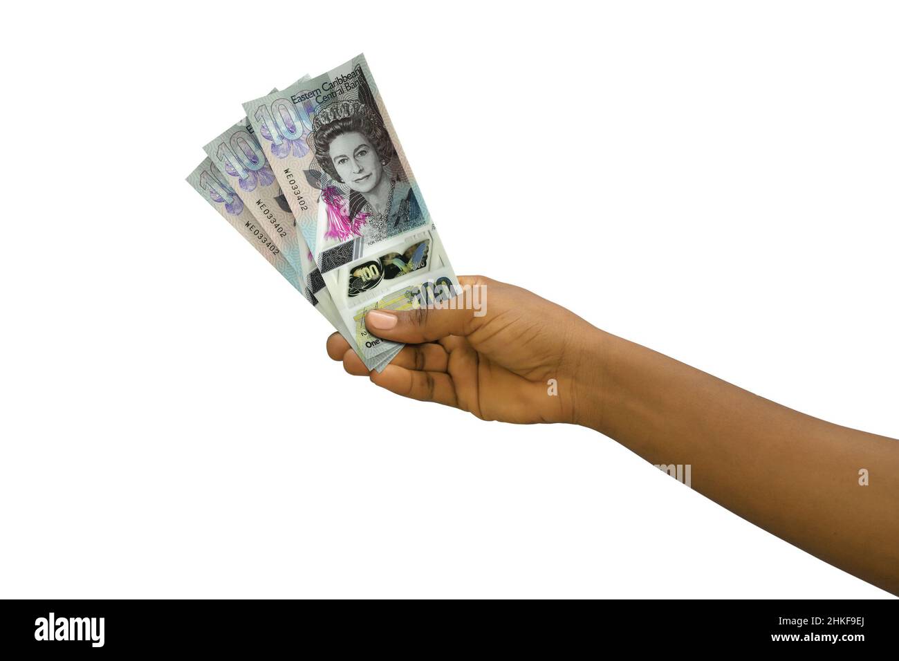 Fair hand holding 3D rendered Eastern Caribbean dollar notes isolated ...