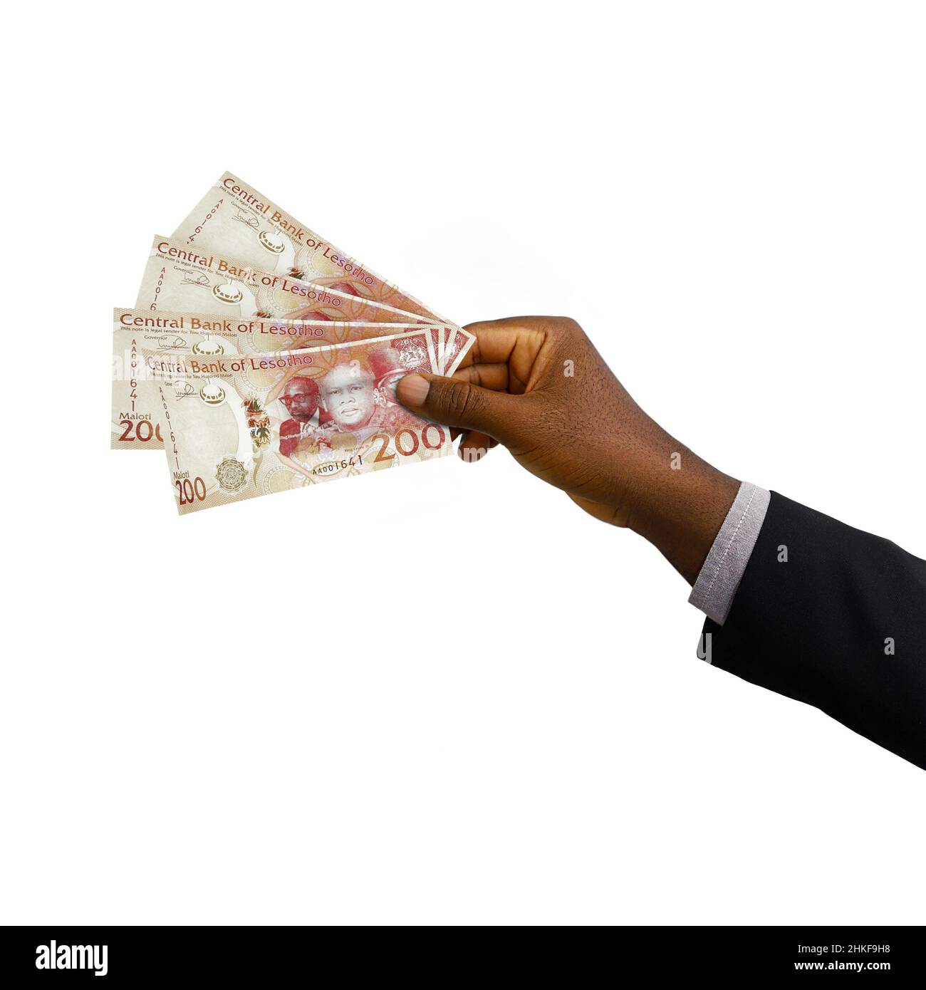 Black hand with suit holding 3D rendered Lesotho loti notes isolated on ...