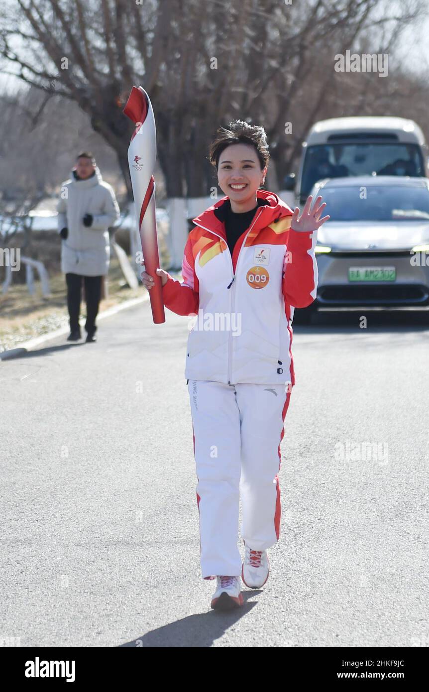 Beijing, China. 4th Feb, 2022. Torch bearer Pu Tianfan runs with the torch during the Beijing ...