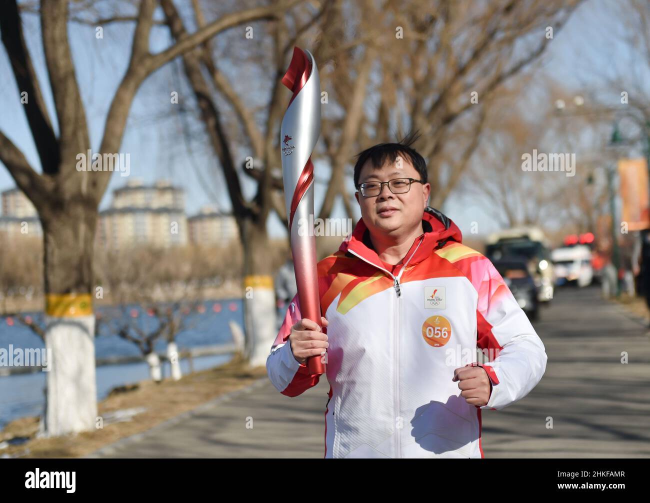 Beijing, China. 4th Feb, 2022. Torch bearer Yao Yue runs with the torch during the Beijing 2022 ...