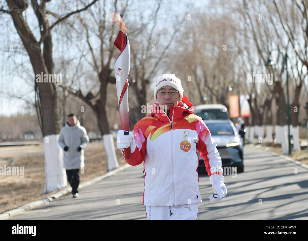 Beijing, China. 4th Feb, 2022. Torch bearer Yahagi Masashi runs with the torch during the ...
