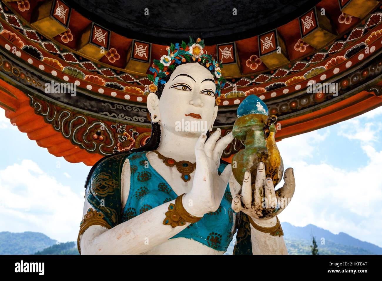 Sculpture of a woman who offers food inside of the Khamsum Yuelley ...