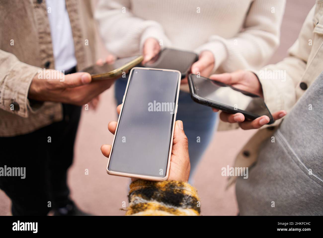 Close up of people hands sharing content on social media network with ...