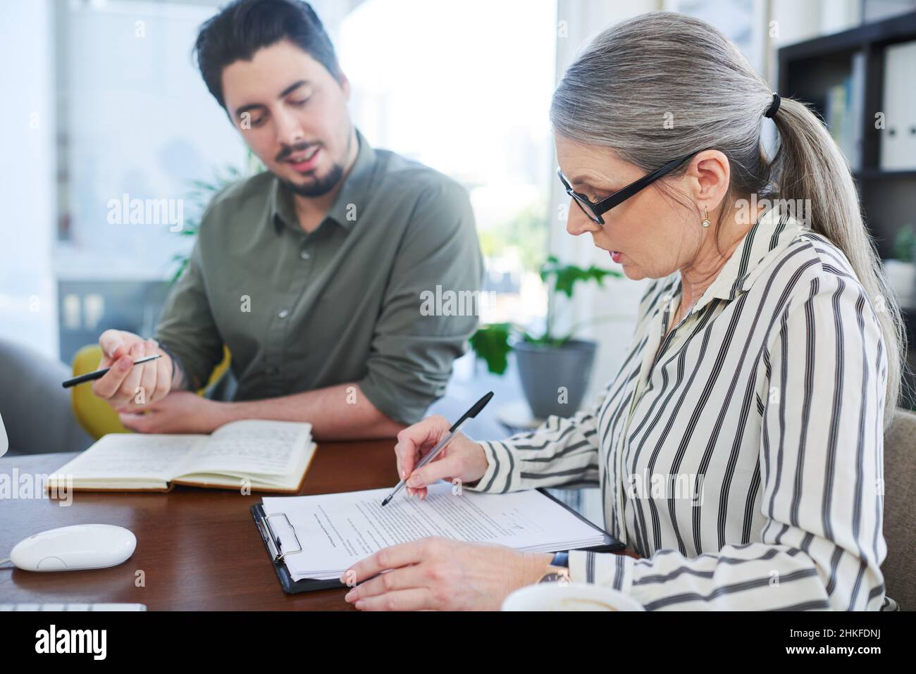 Ensuring their paperwork is up to date Stock Photo - Alamy