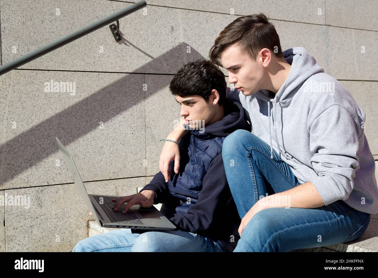 School boys side by side back view hi-res stock photography and images ...