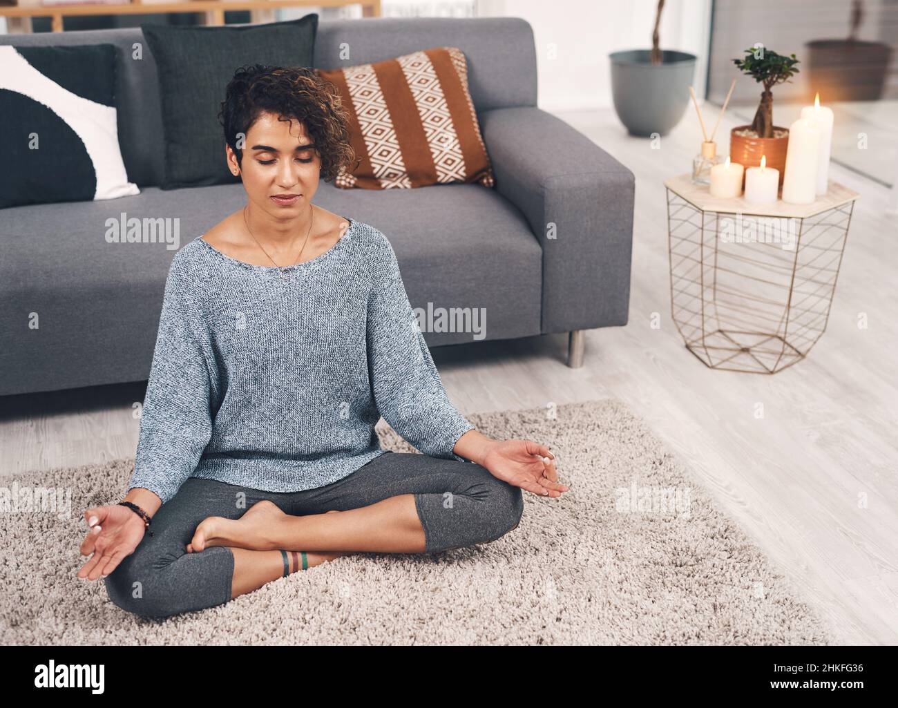 Namaste right here. Full length shot of an attractive young woman ...
