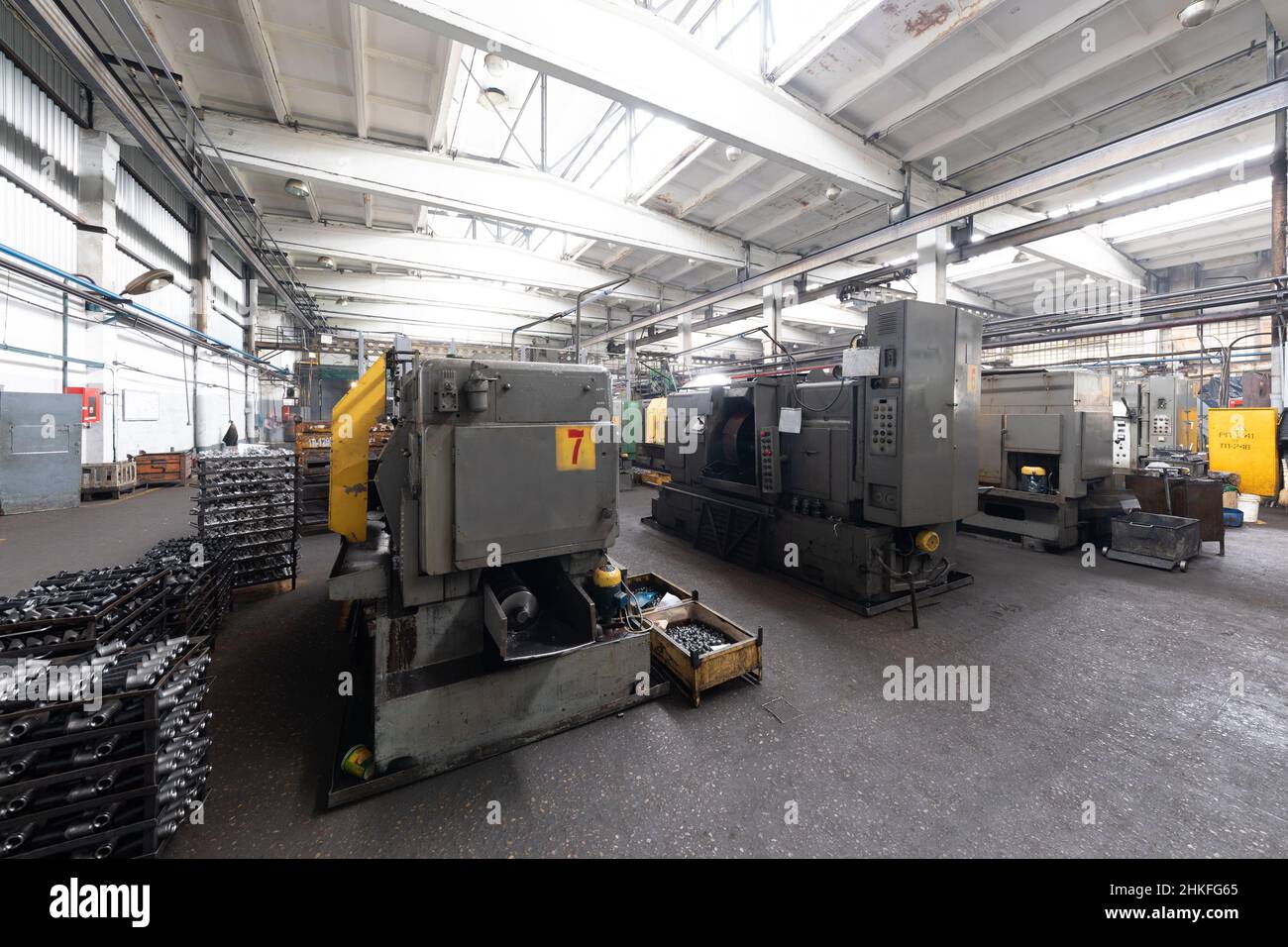 The interior of a big industrial building of factory with steel ...