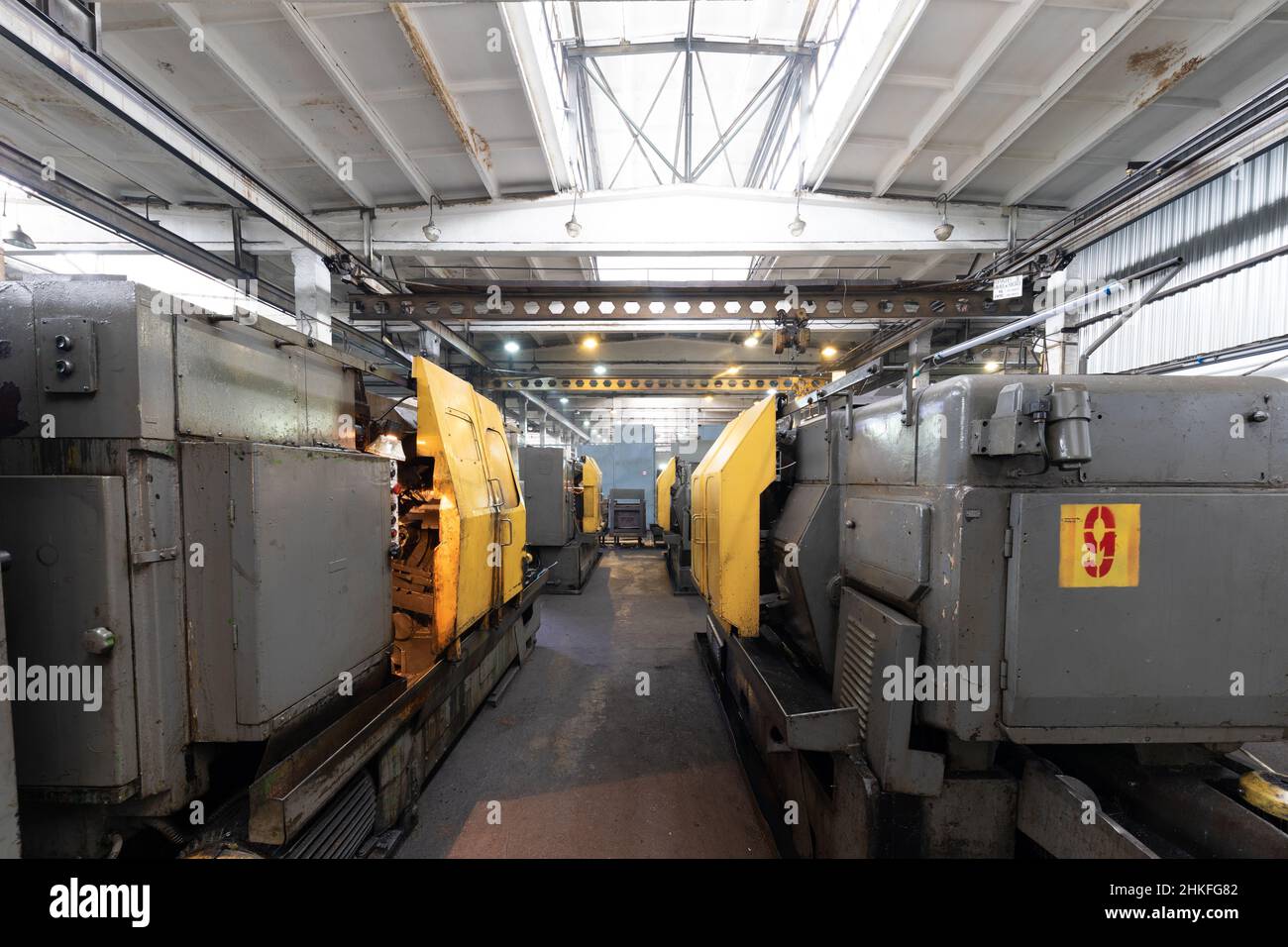 The interior of a big industrial building of factory with steel ...