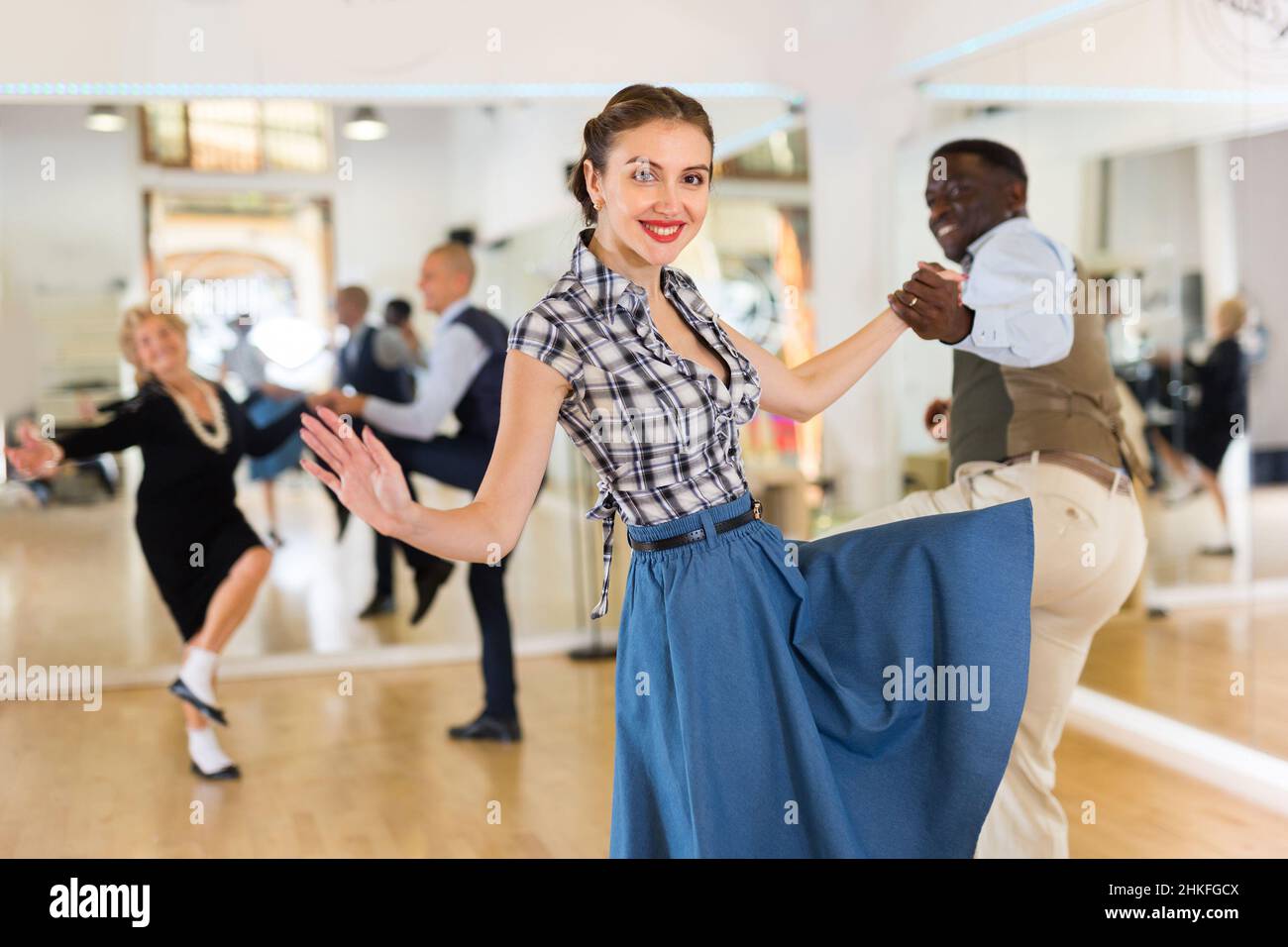 Woman with african man practising charleston dancing Stock Photo - Alamy