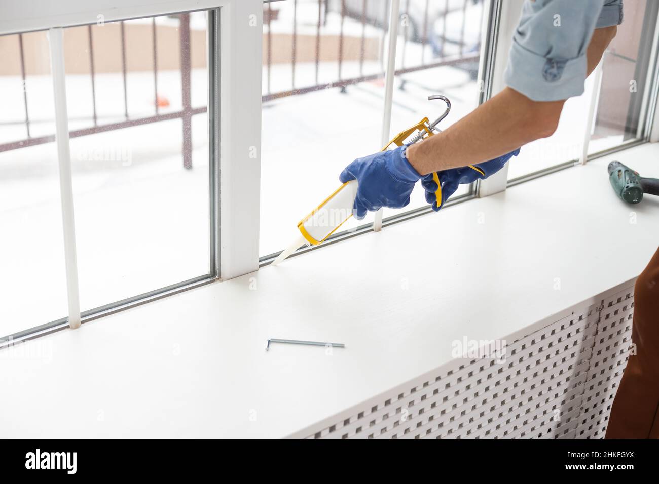 The worker installing and checking window in the house Stock Photo - Alamy
