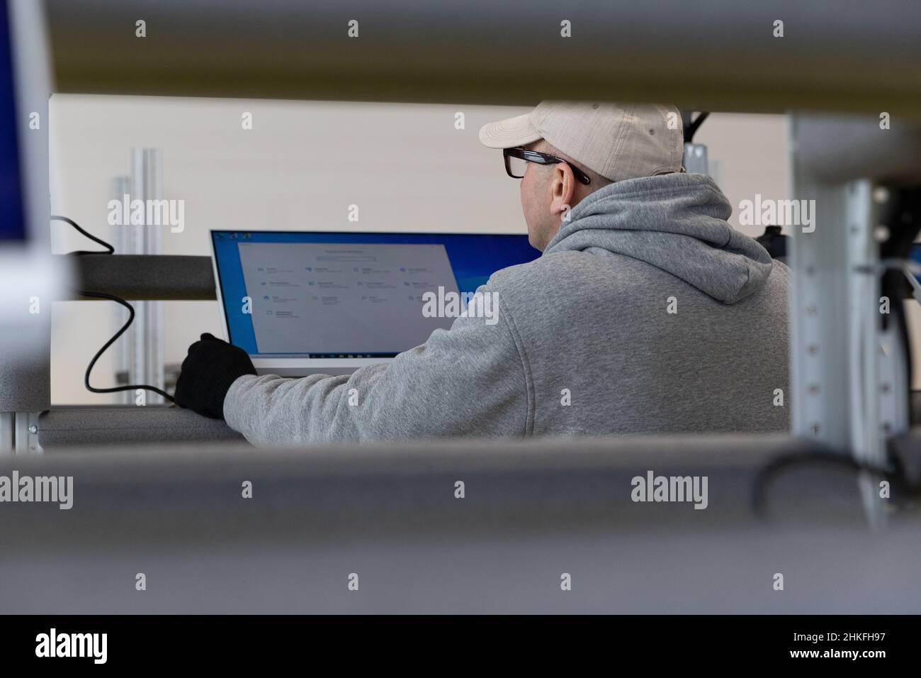 Minsk, Belarus - Jan 05, 2022: Photo of a man in a gray suit checking ...