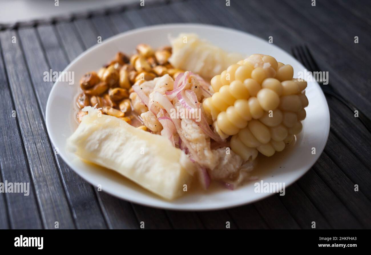 Peruvian traditional dish.fish ceviche with yuka and corn Stock Photo ...