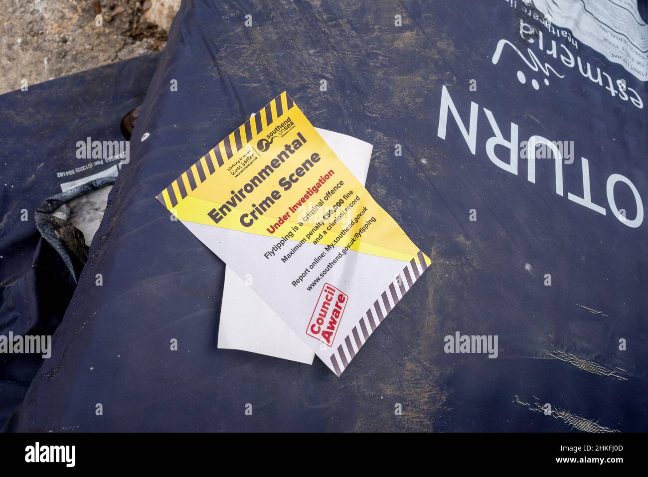 Environmental Crime Scene sticker on a pile of dumped waste on a ...